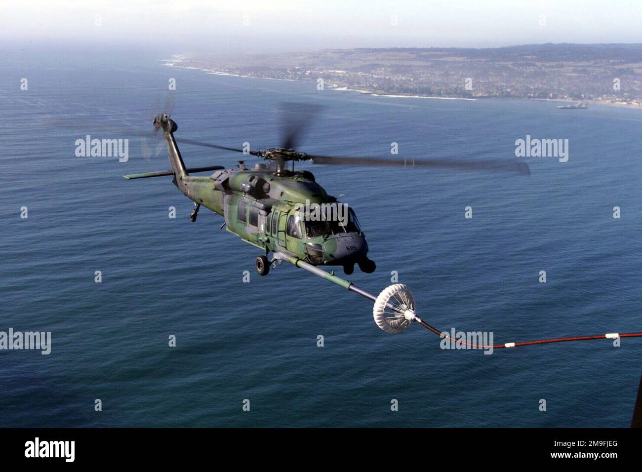 An aerial view of an HH-60G Pavehawk helicopter from the 129th Rescue ...