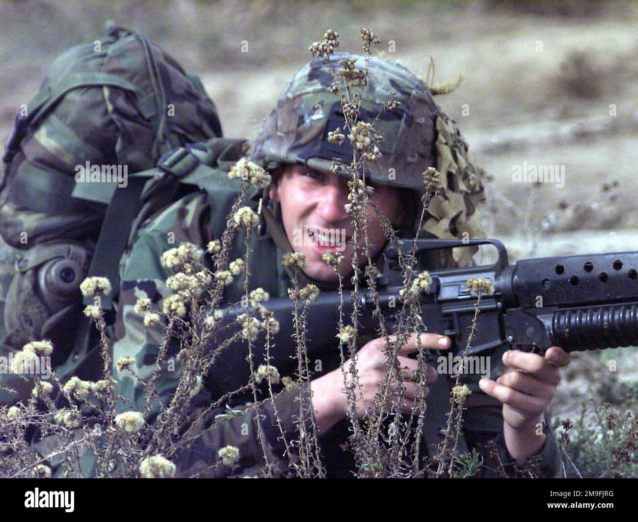 A Marine attacking the objective, with an M16 A-2 Service Rifle with M ...