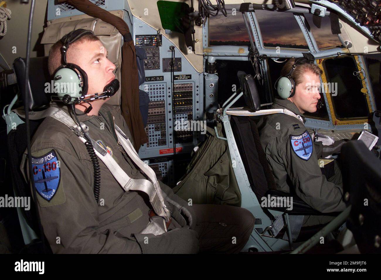 An interior view of the cockpit of a C-130E Hercules aircraft from the ...