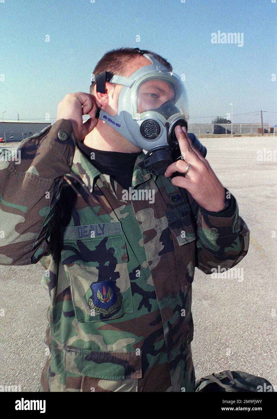 US Air Force STAFF Sergeant Michael Dealy prepares to remove his MCU-2P ...