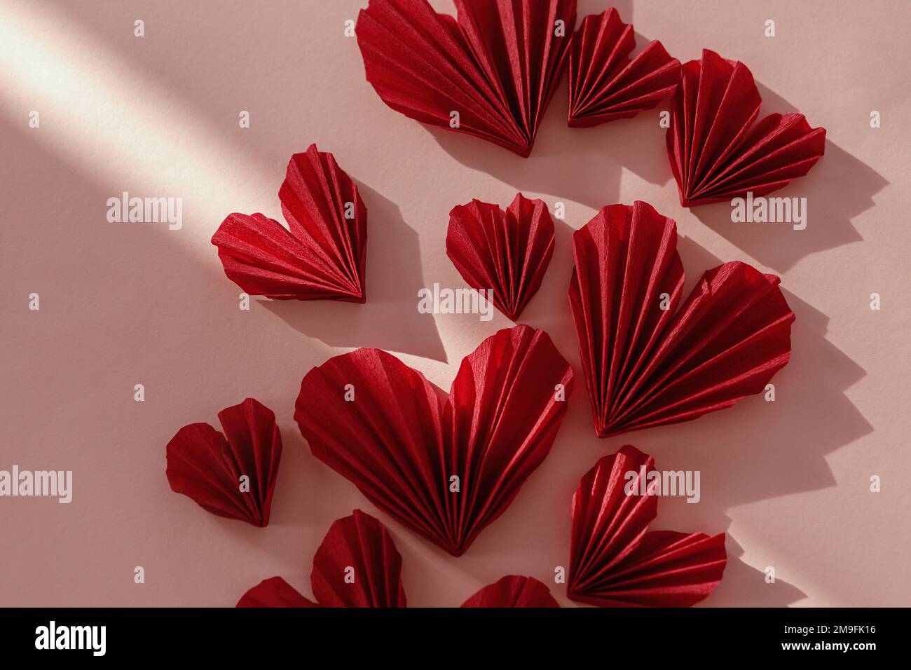 Valentines day flat lay. Stylish red hearts composition on pink paper ...