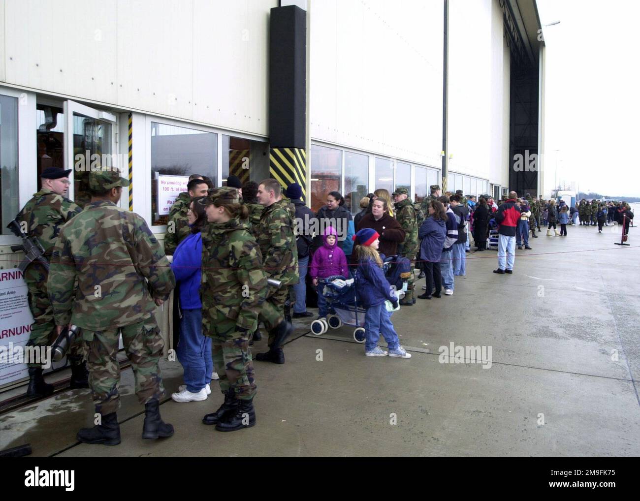 Folks at Ramstein Air Base, Germany, wait outside to be let into the ...