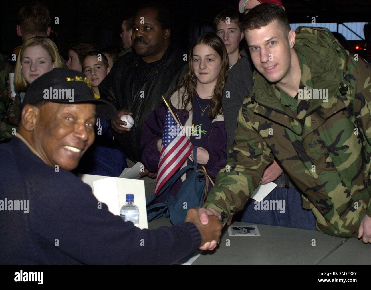 US Air Force STAFF Sergeant Michael Whitlock (Right) shakes hands with ...