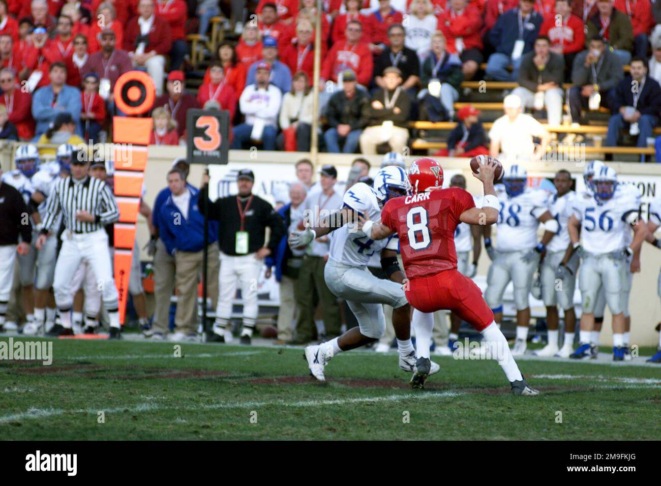 US Air Force Academy Falcon Jamie Arthur goes for the sack during the ...