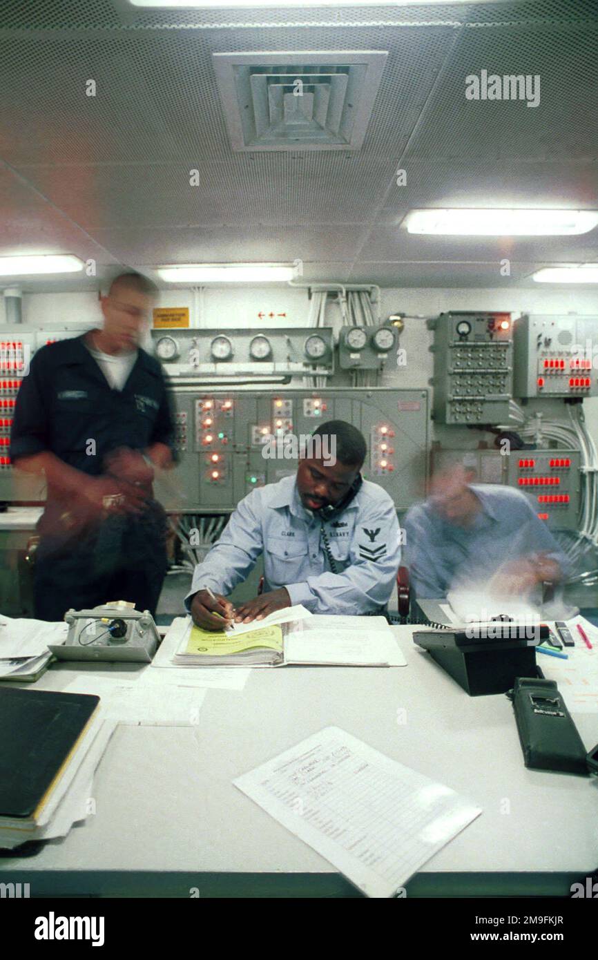 US Navy Electrician's Mate First Class Thomas Clark mans the trouble ...