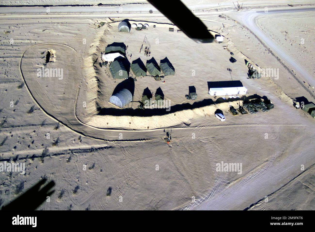 A view from a CH-53E Super Stallion over a portion of Camp Wilson ...