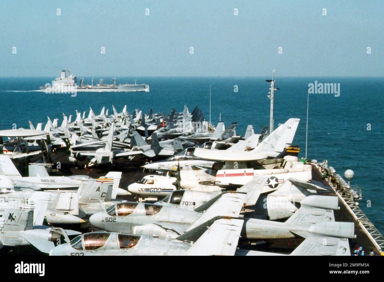Shot of the flight deck, with E-2C Hawkeye, S-3B Viking and F/A-18 ...