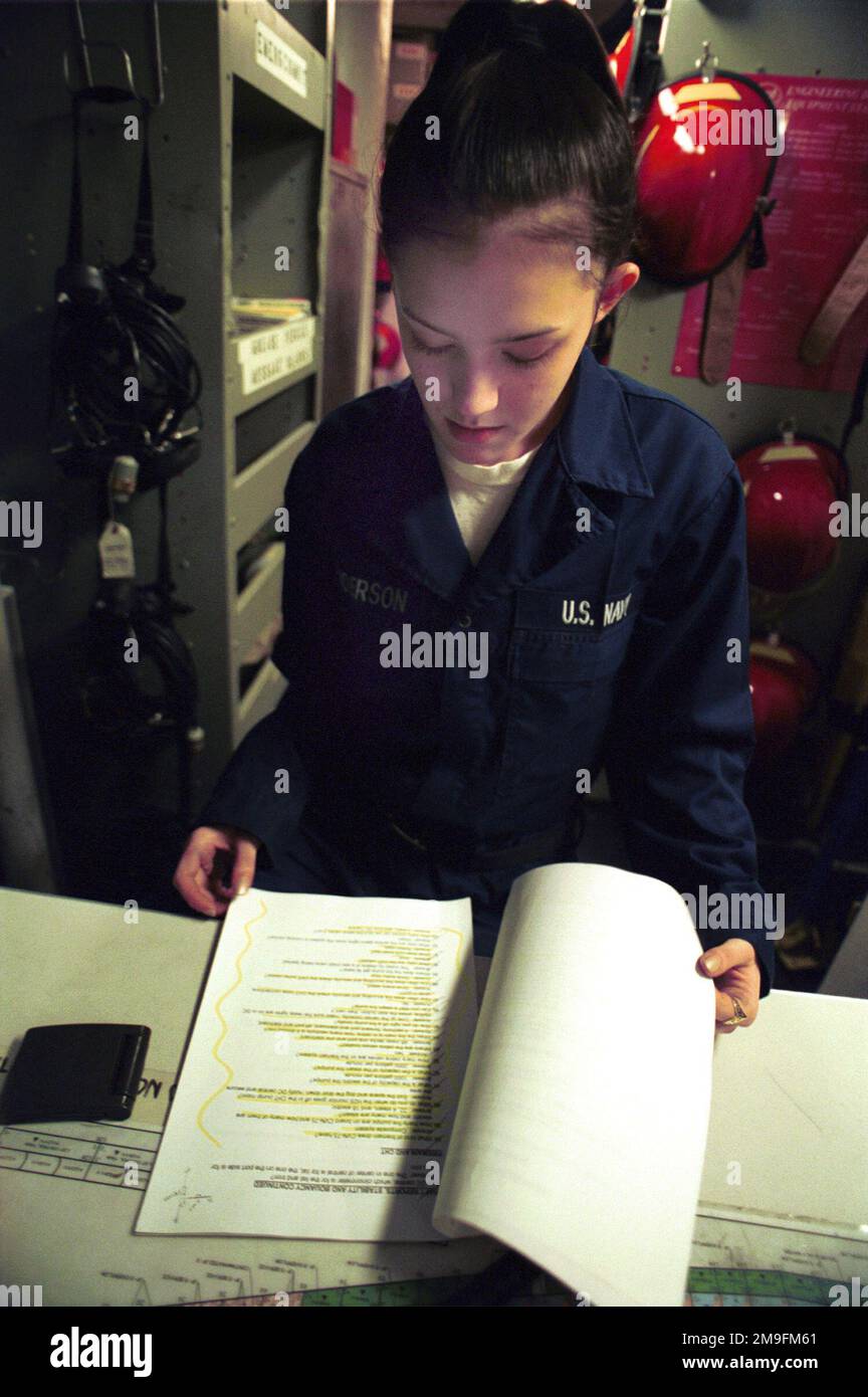 US Navy Fireman Apprentice Jennifer L. Anderson studies for her damage ...