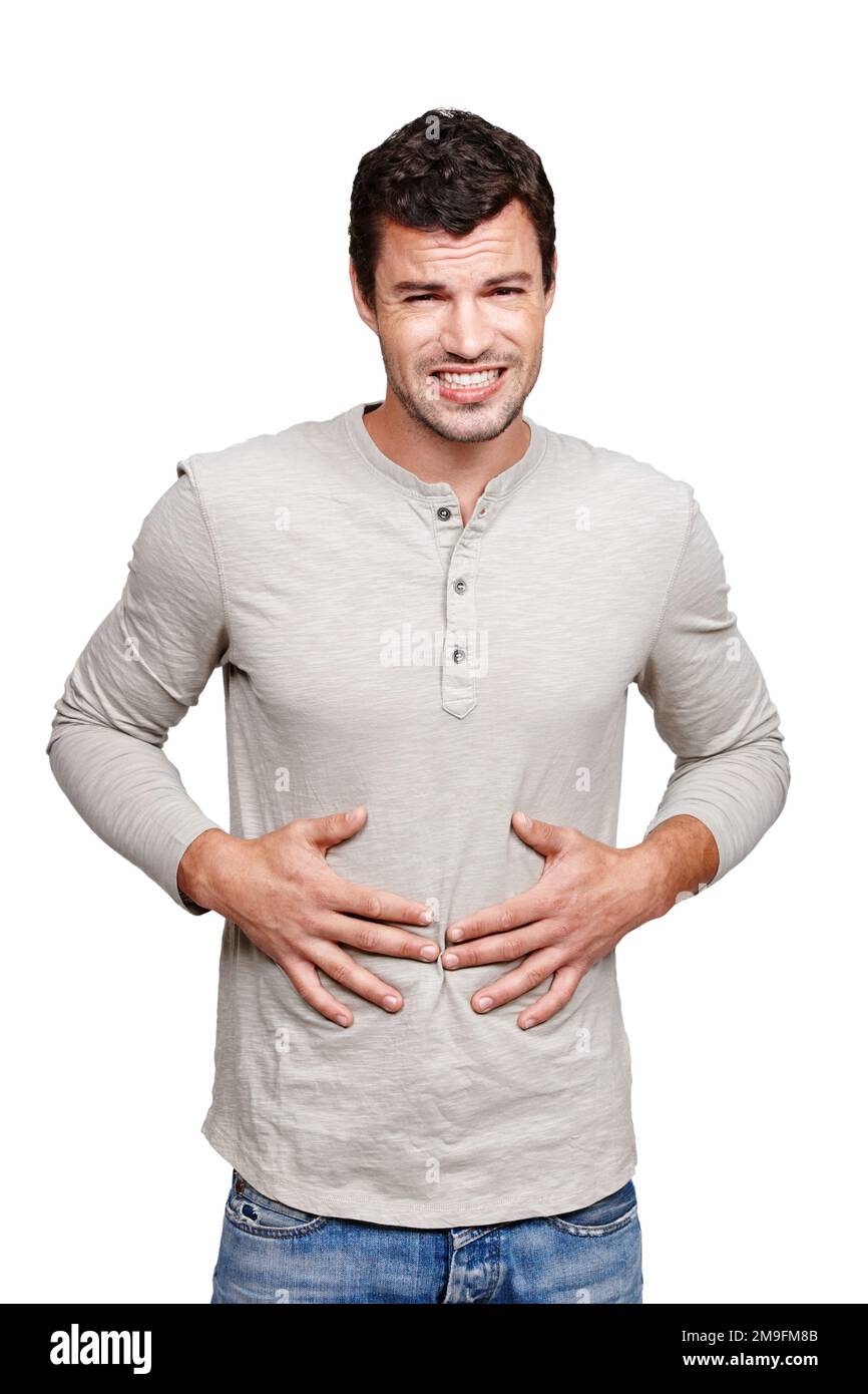 Hungry, sick and portrait of a man with a stomach problem isolated on a ...