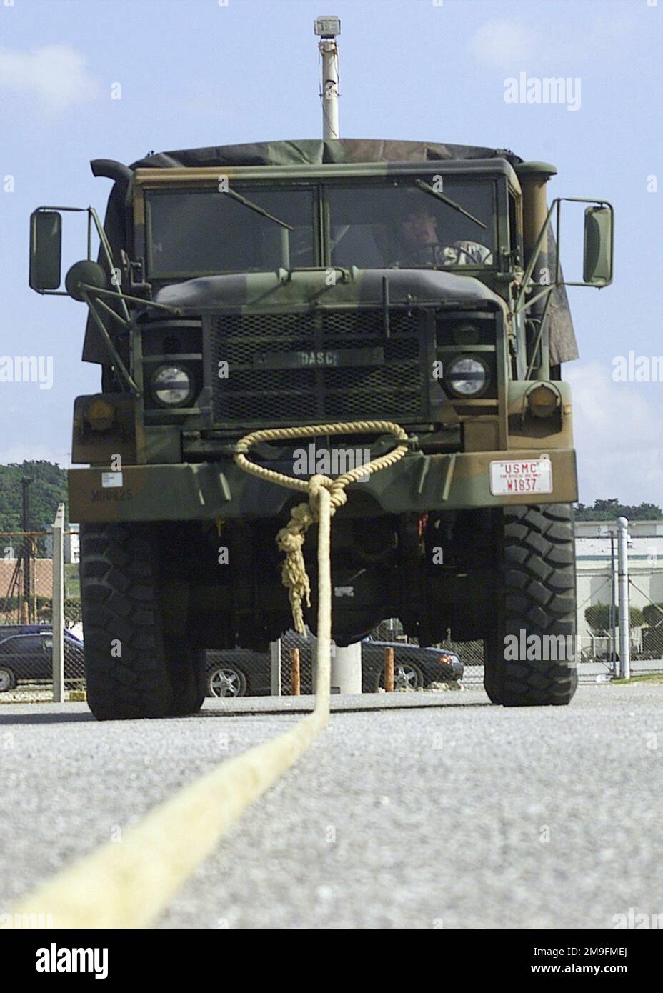 Lance Corporal Brian M. O'Neil sits ready to release the brake of a ...