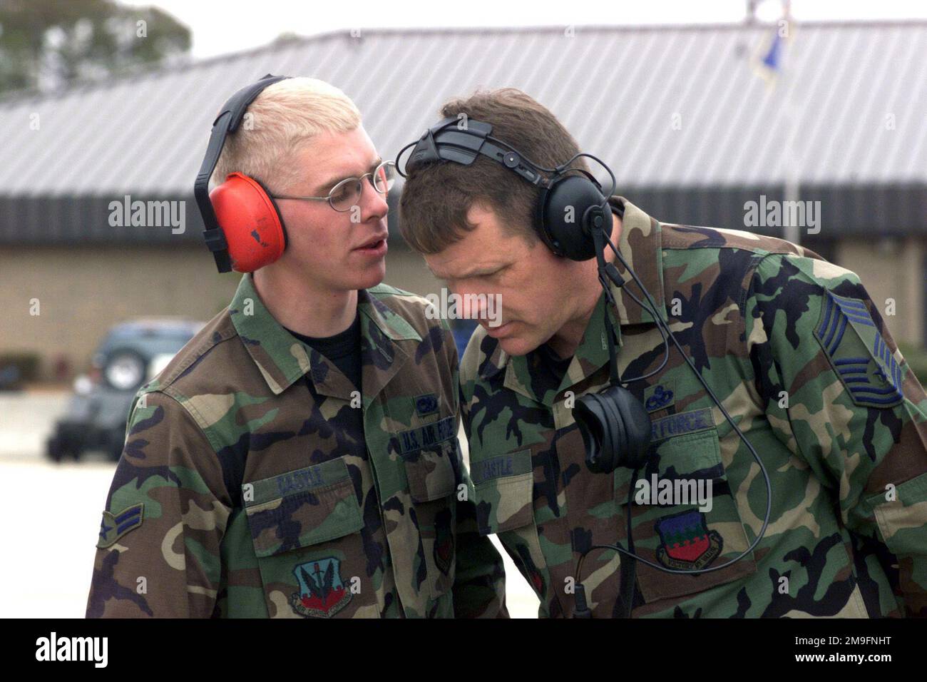 US Air Force CHIEF MASTER Sergeant Carey Castle (right) strains to hear ...