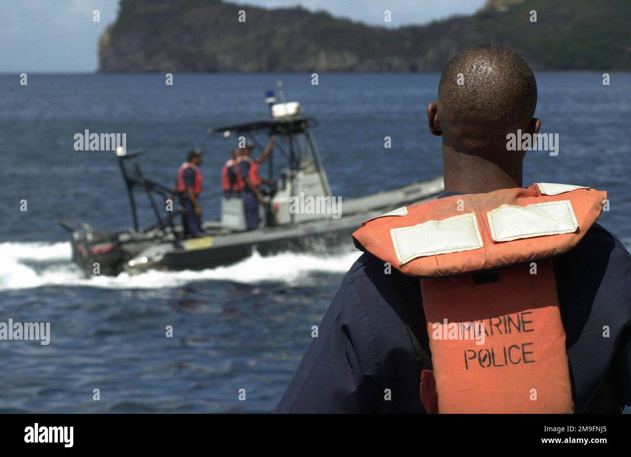 Constable Jonas Gideon of the Saint Lucian Marine Police keeps an eye ...