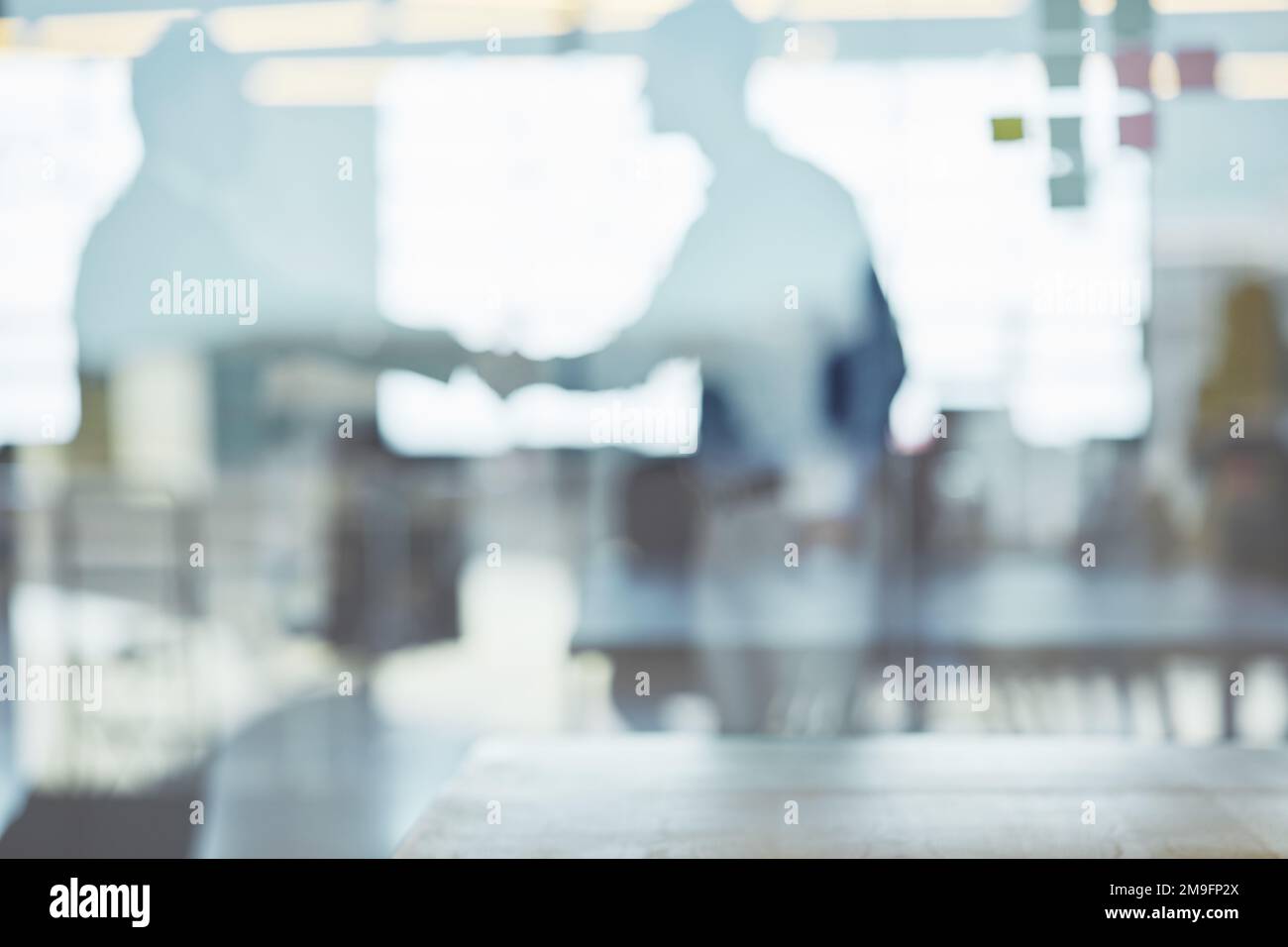 Through the window, business people and handshake for corporate deal ...
