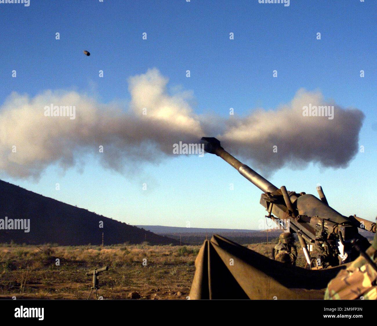 A round from an M-198 Howitzer from 1ST Battalion, 12th Marines, blasts ...