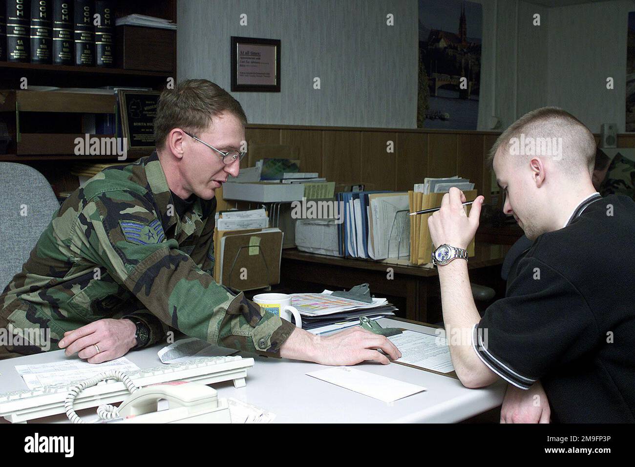 Tax shelter volunteer US Air Force STAFF Sergeant James Ludwig (left ...