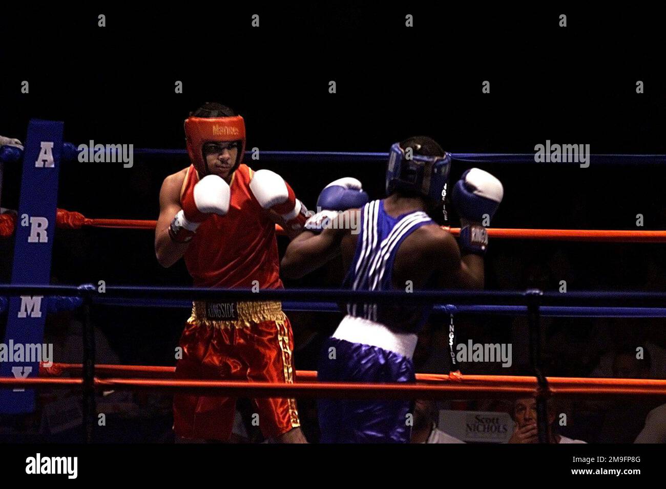US Air Force boxer John Askew (In blue) and US Marine Corps boxer ...