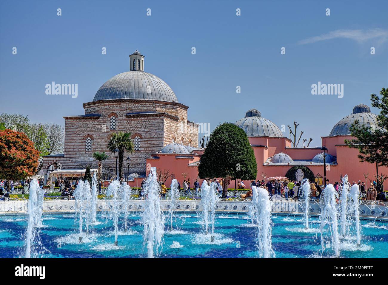 The crowded Sultanahmet square with fountains in old Istanbul, Turkey ...