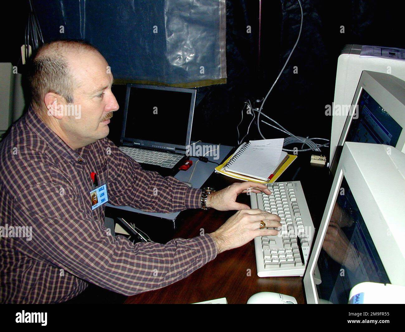 Robert Hutchens, forward deployed systems administrator, performs ...