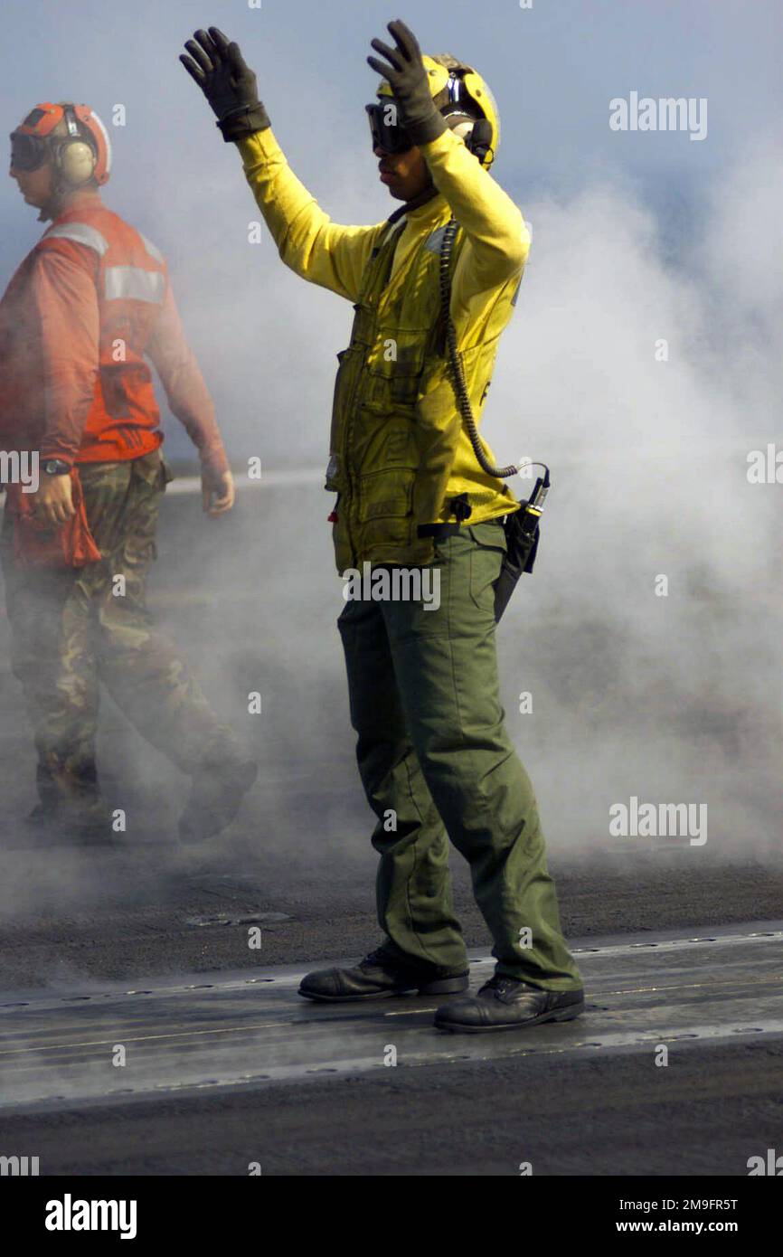 Aviation Boatswain's Mate (Handler) Third Class Jamorn Driver directs ...