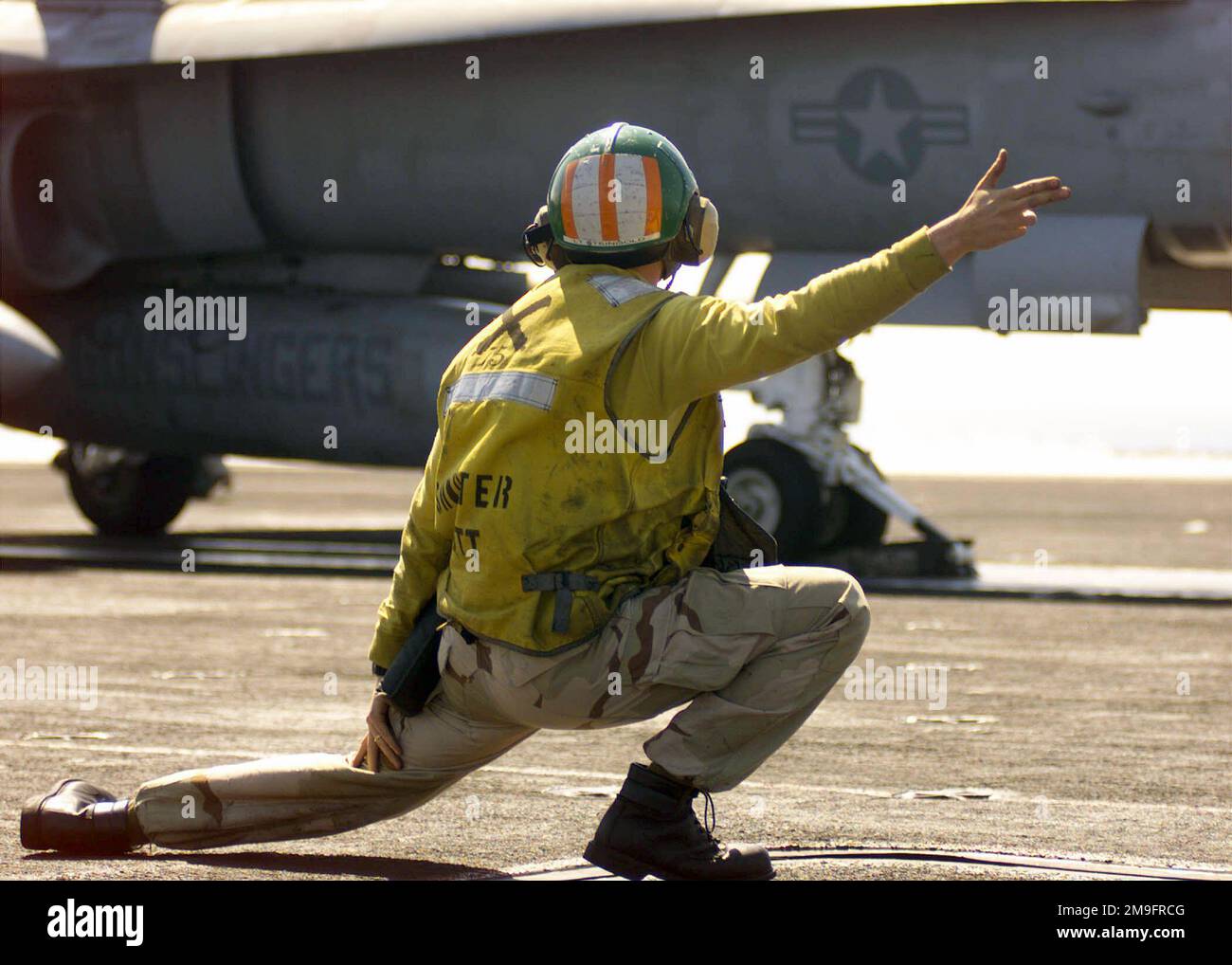 Lieutenant Jay Steingold gives the signal that it is safe to launch to ...