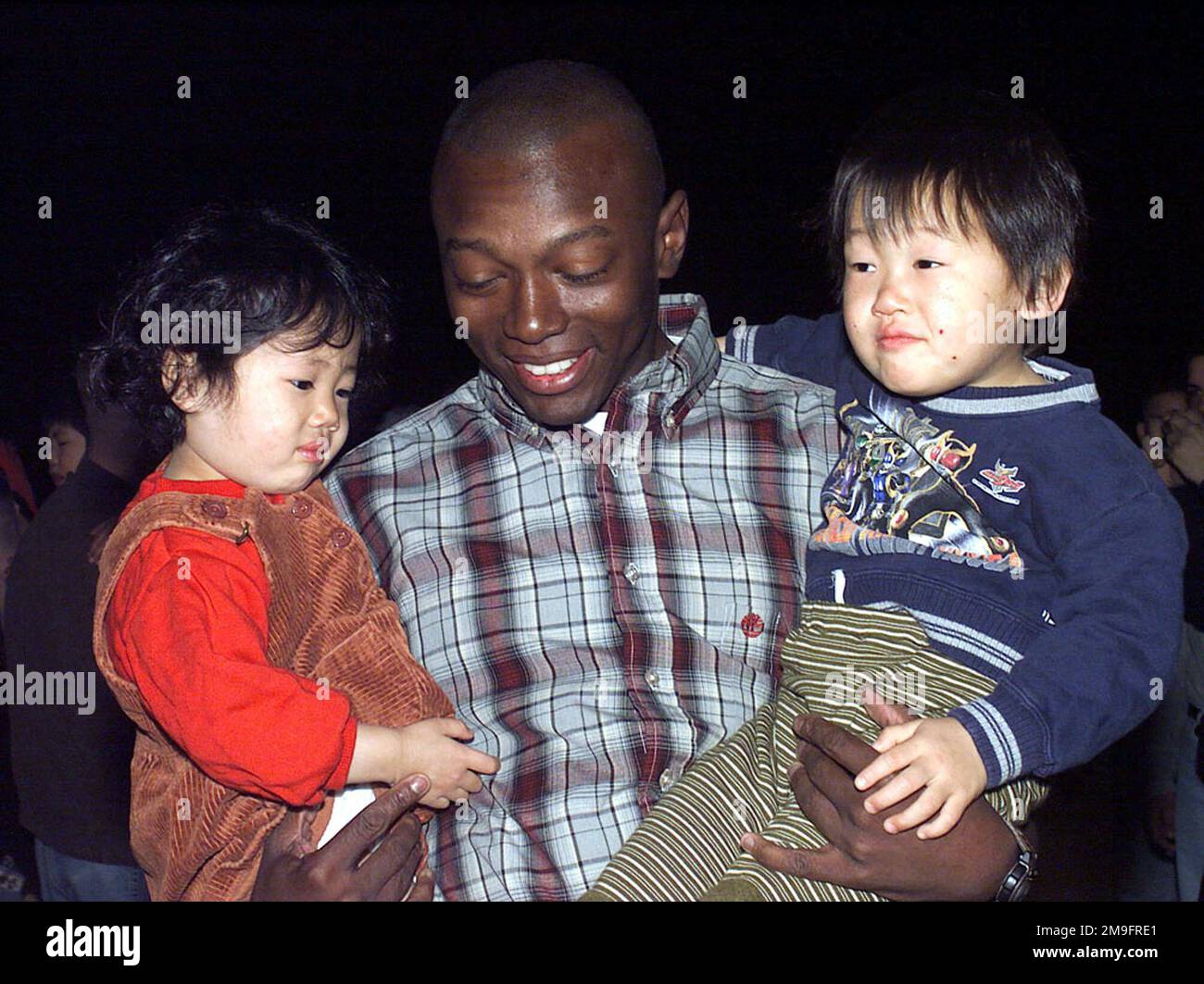 Sergeant Tyrone Crutcher (center) cuddles Kwita (left) and Hiera (right ...