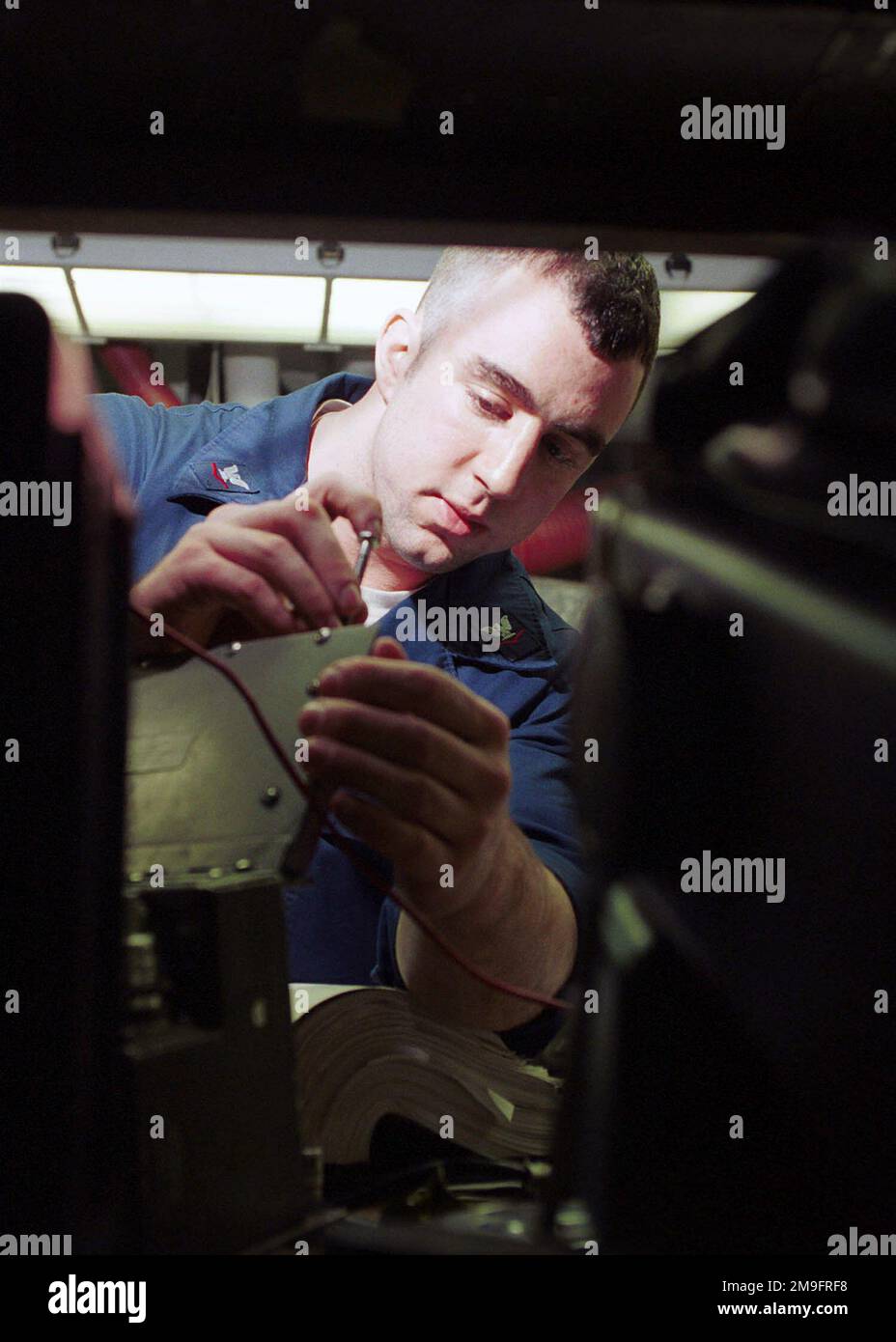 Aviation Electronics Technician Third Class Jamie Brennan calibrates a ...