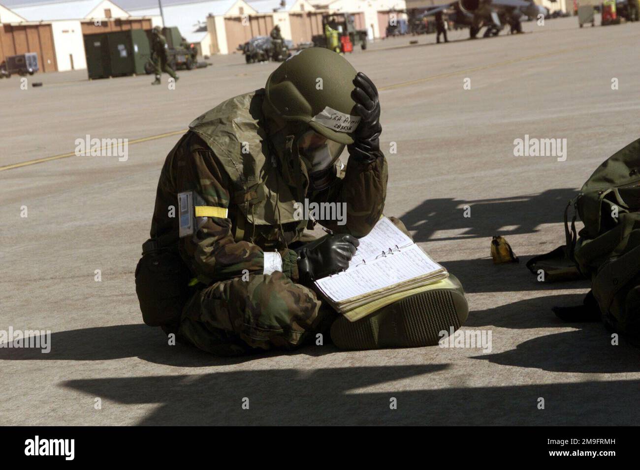 US Air Force AIRMAN First Class Chad Armold makes entry in his log book ...