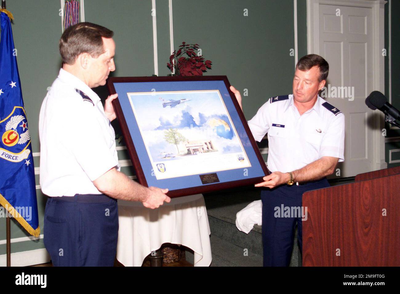 US Air Force Colonel Dana T. Atkins (right) presents US Air Force Brigadier General Mark A ...