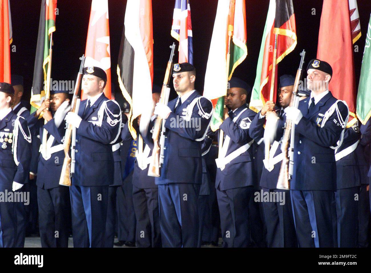 US Air Force drill team members present the flags of the Operation ...