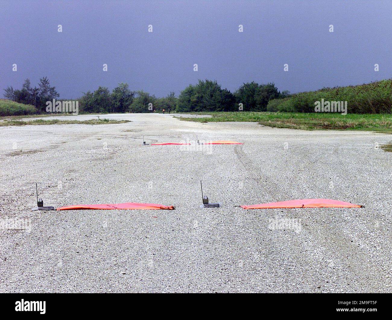 The start of a runway 2300 feet from the tree line. Lights and flags ...