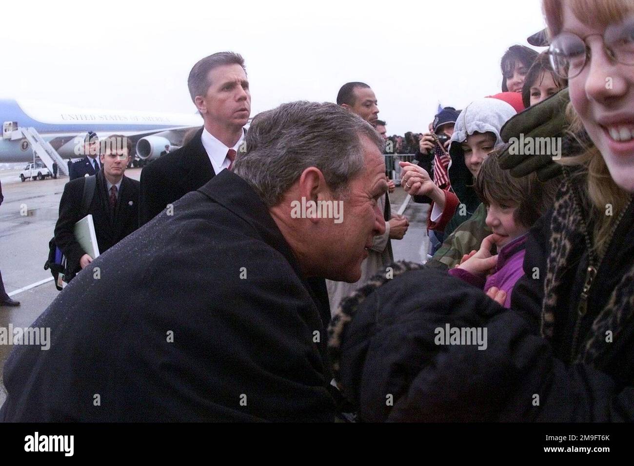 US President George W. Bush greets the daughter of US Air Force MASTER ...