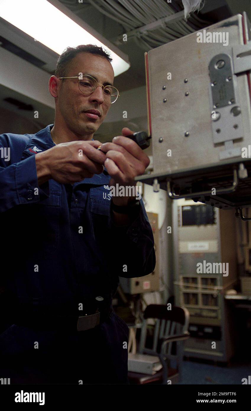 US Navy Electronics Technician Second Class Eduardo Melindez performs ...