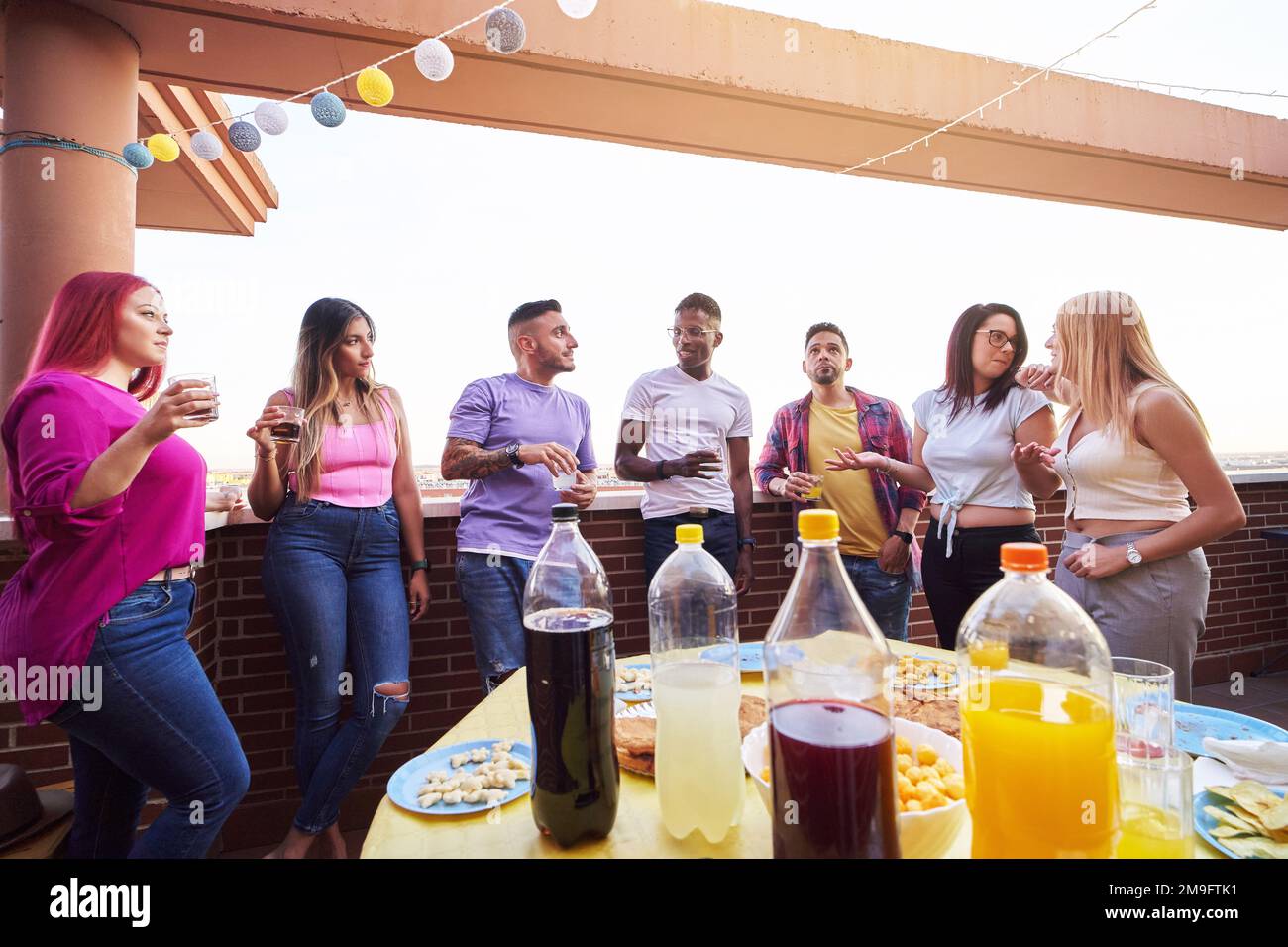 Group of friends enjoying and relaxing while having a party on a ...