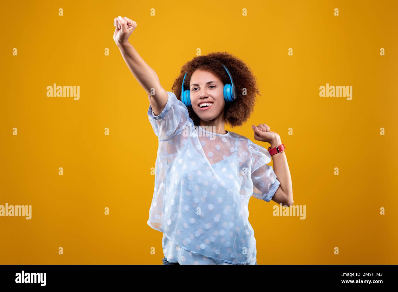 Curly woman listening dance music hi-res stock photography and images ...