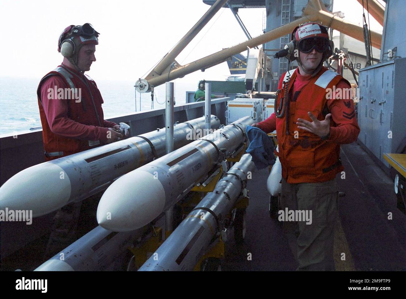 AIRMAN Brian Hill and Aviation Ordnanceman Second Class Toby Snowden ...