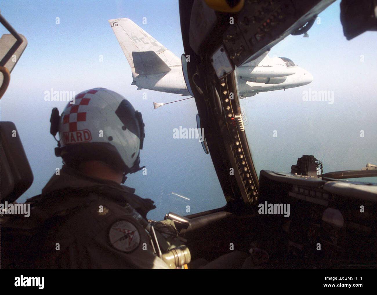 Lieutenant Commander Chris "Ward" Schenck keeps an eye on surrounding S ...