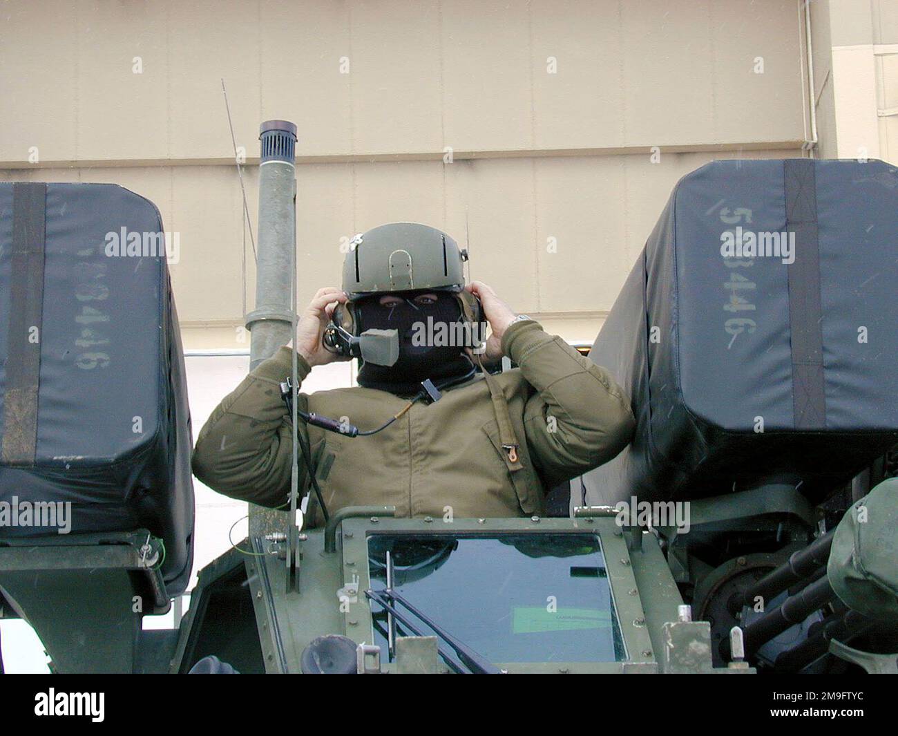 Vehicle Commander US Marine Corps Sergeant K.S. Mills dons his gear ...