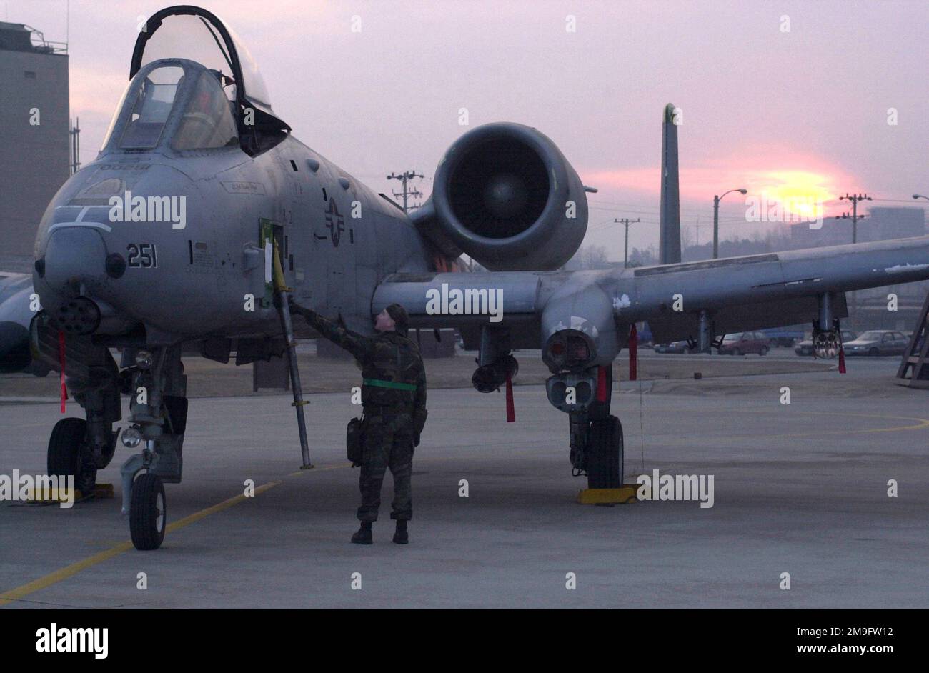 US Air Force Technical Sergeant Roberts, 27th Fighter Squadron, lowers ...