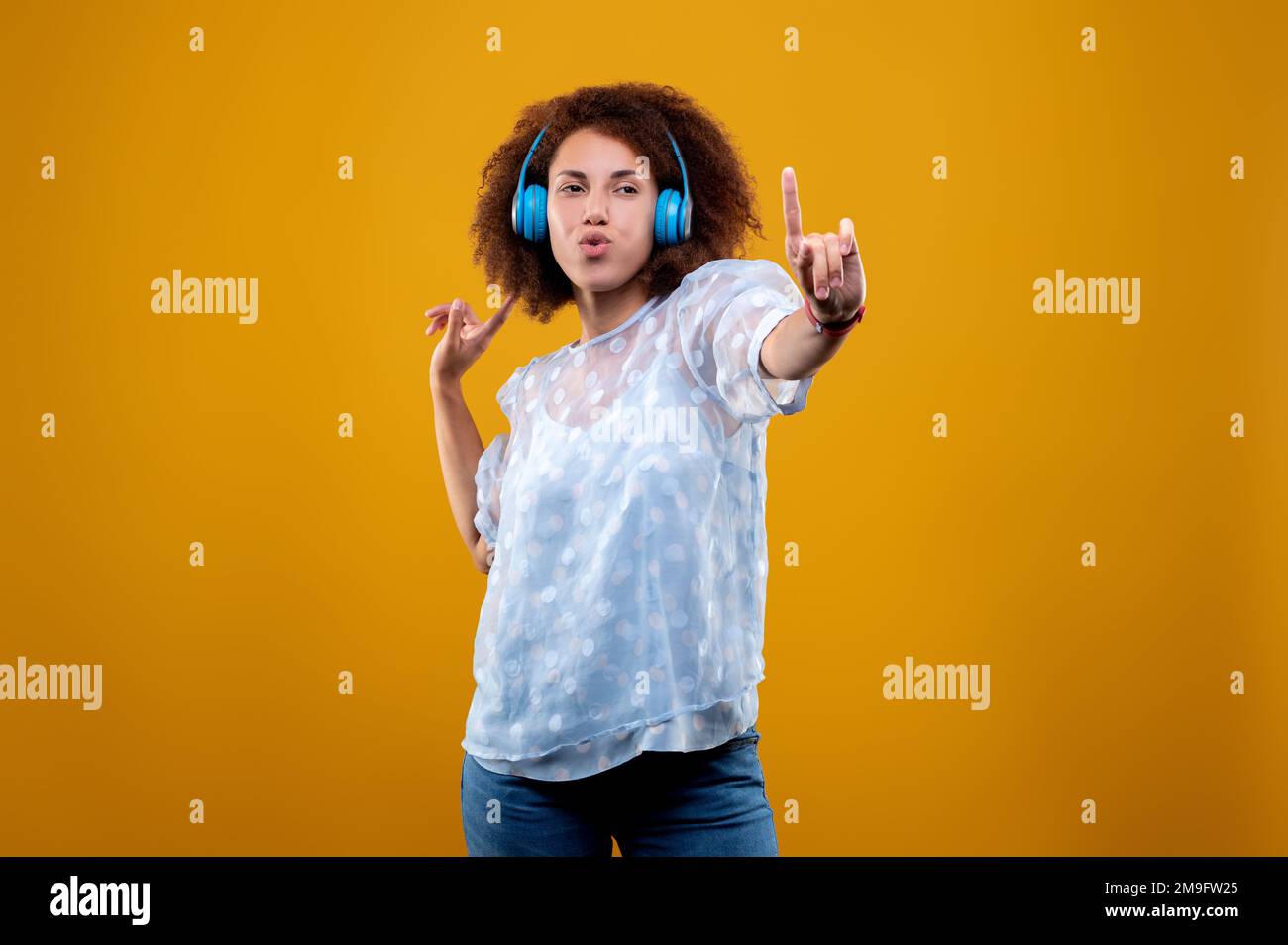 Curly woman listening dance music hi-res stock photography and images ...
