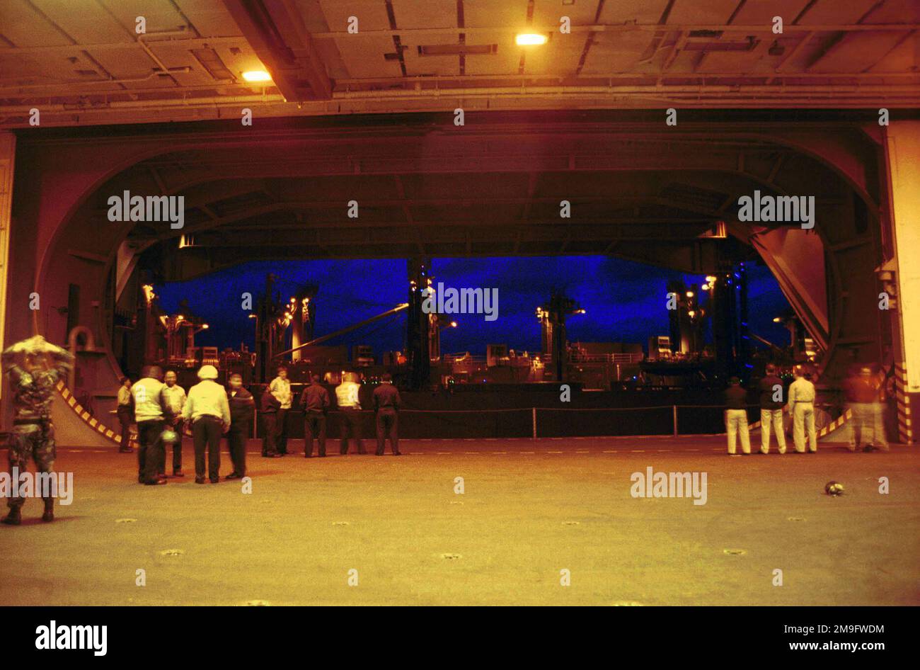 The deck department of the USS THEODORE ROOSEVELT (CVN-71) prepares for ...