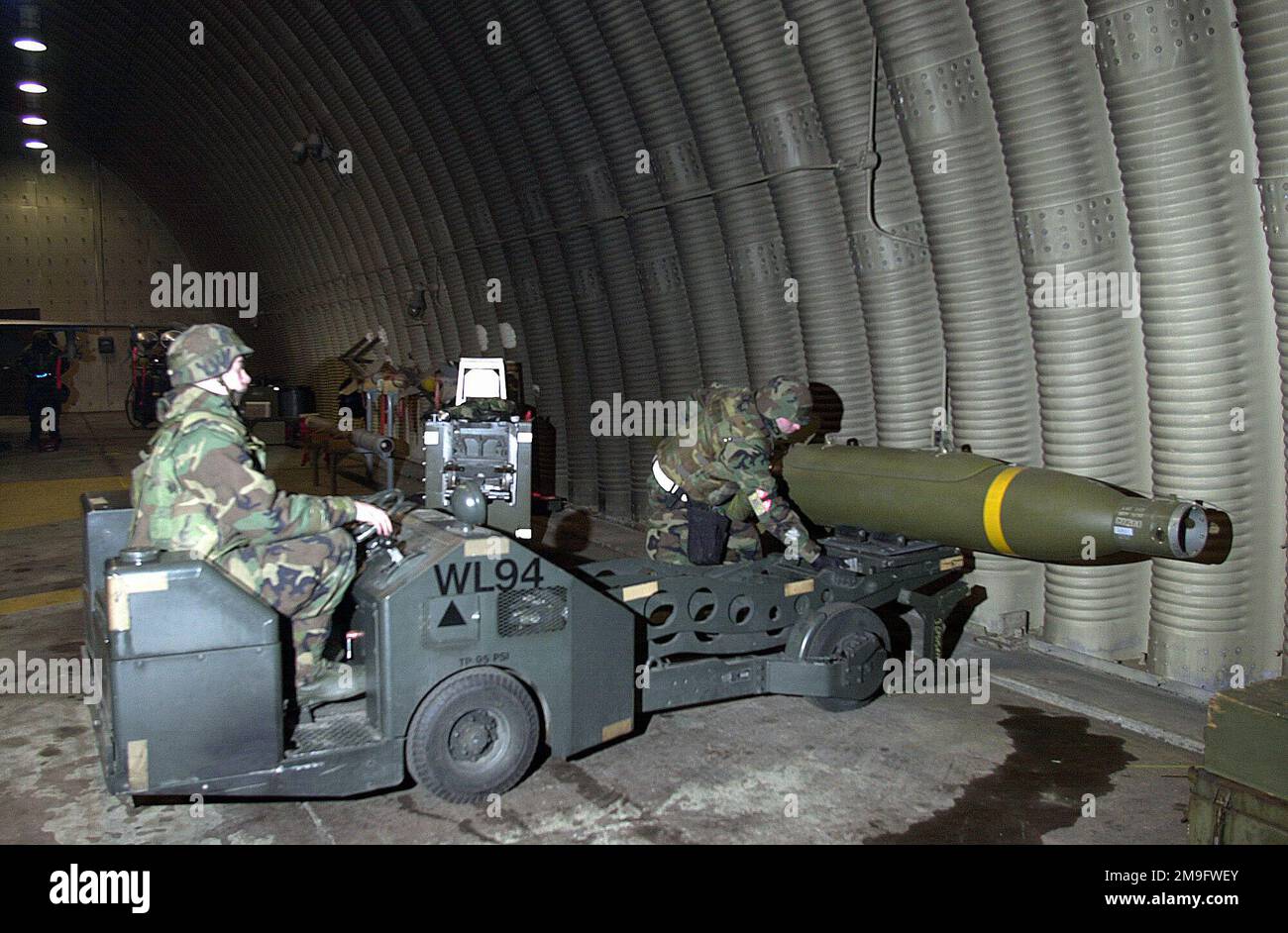 US Air Force SENIOR AIRMAN Patrick Fotz, 36th Fighter Squadron, guides ...