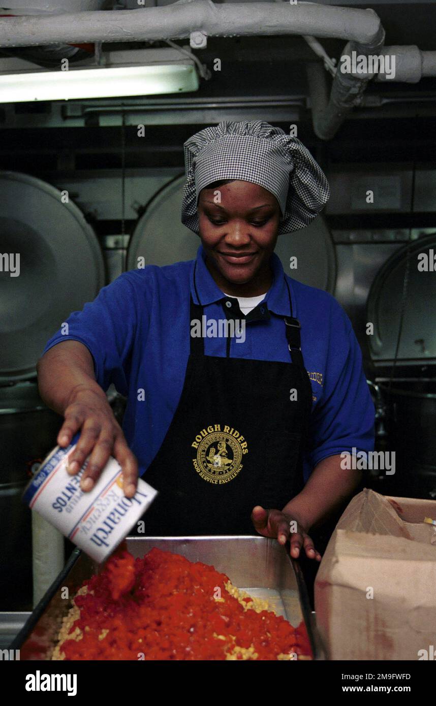 Mess SPECIALIST SEAMAN Deirdre Vickers empties a can of pimentos onto ...