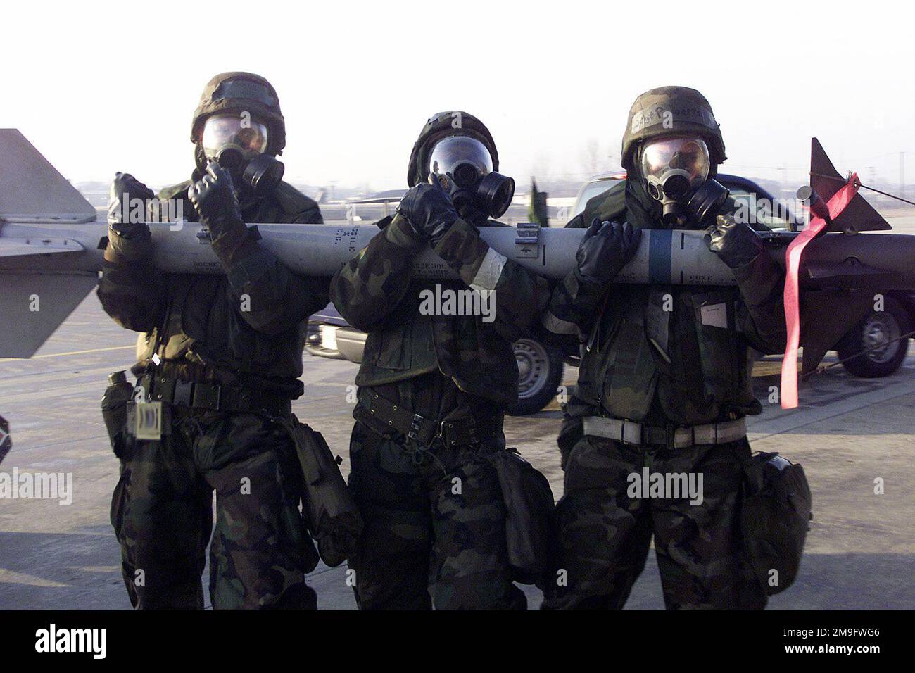 Dressed in protective gear, US Air Force SENIOR AIRMAN Shawn Riley, US ...