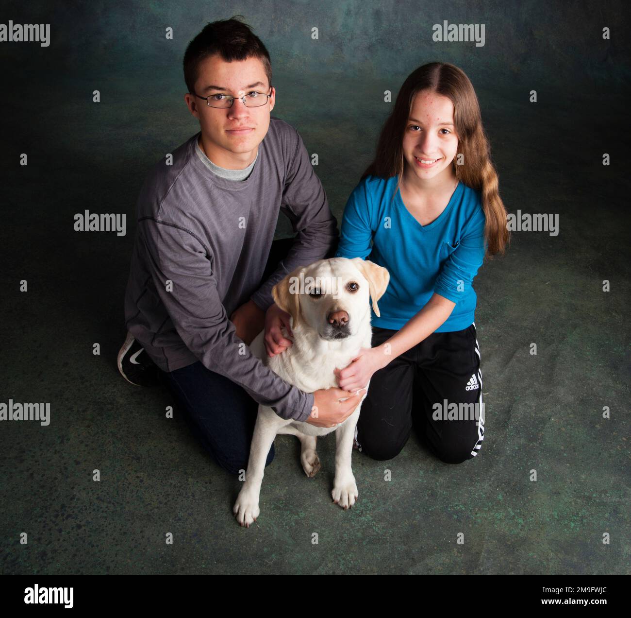 Portrait of Labrador with owners Stock Photo - Alamy