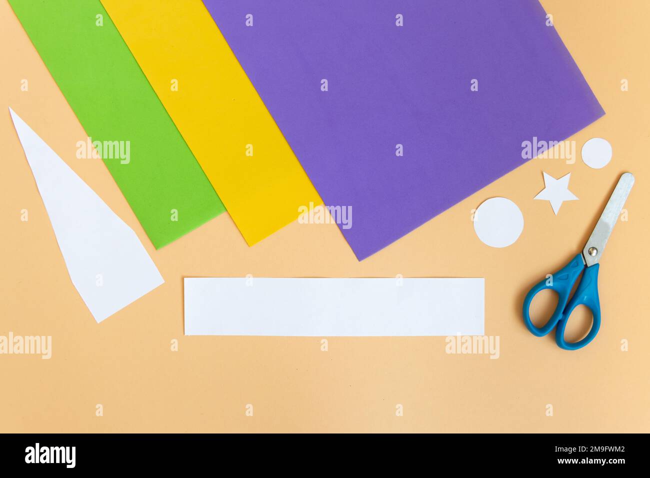 Mardi gras carnival jester hat hat on head made of paper . Step by step ...