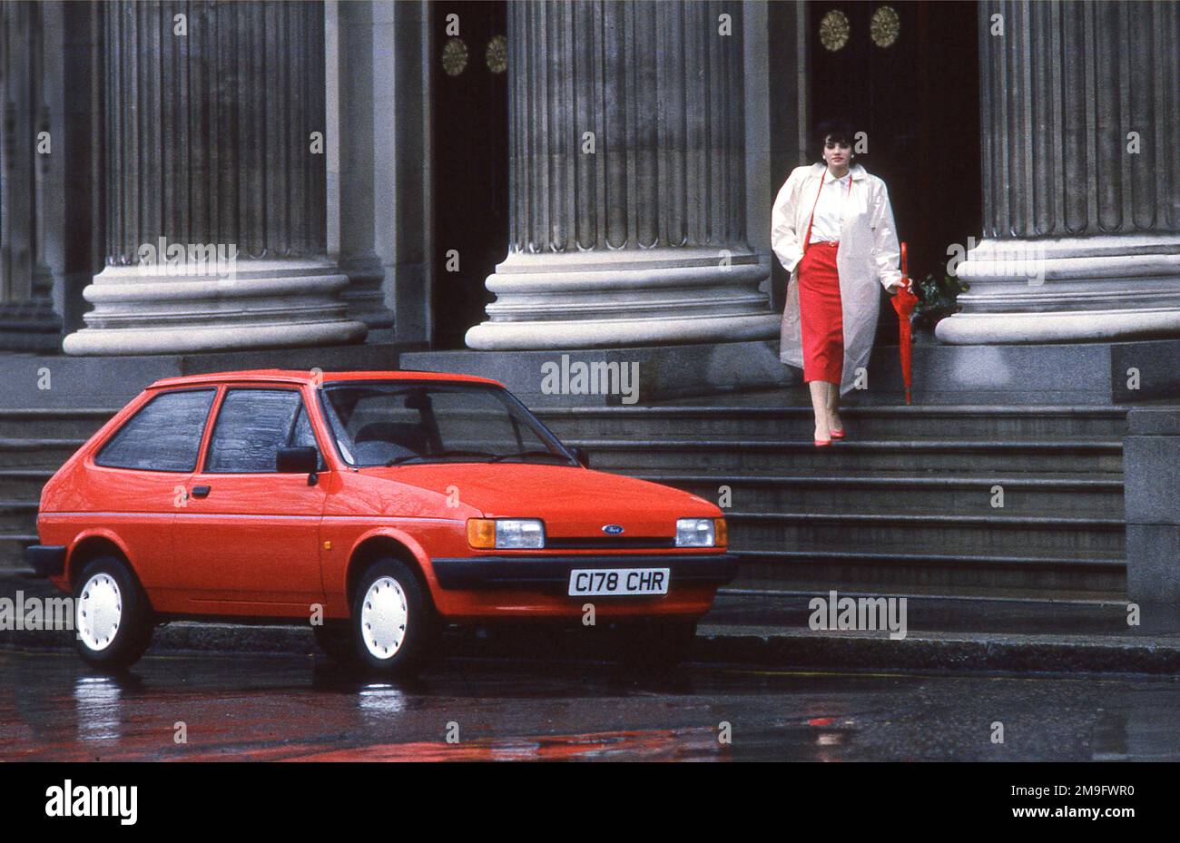 Woman with a 1985 Ford Fiesta in the City of London UK Stock Photo - Alamy