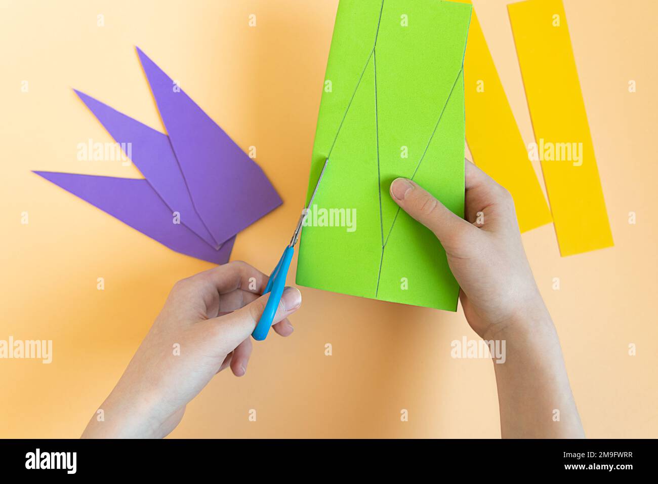 Mardi gras carnival jester hat on head made of paper . Step by step ...