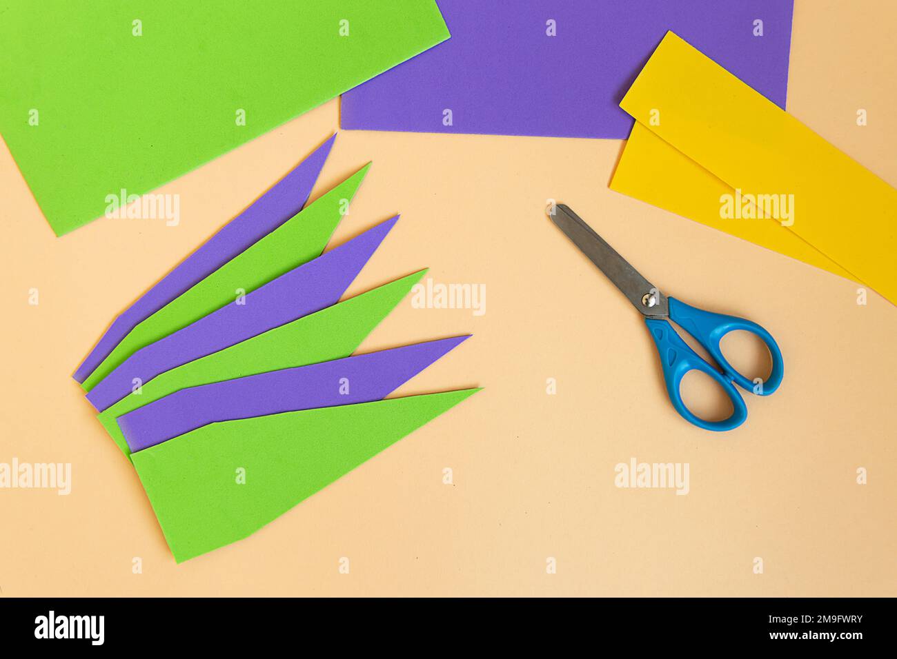 Mardi gras carnival jester hat on head made of paper . Step by step ...