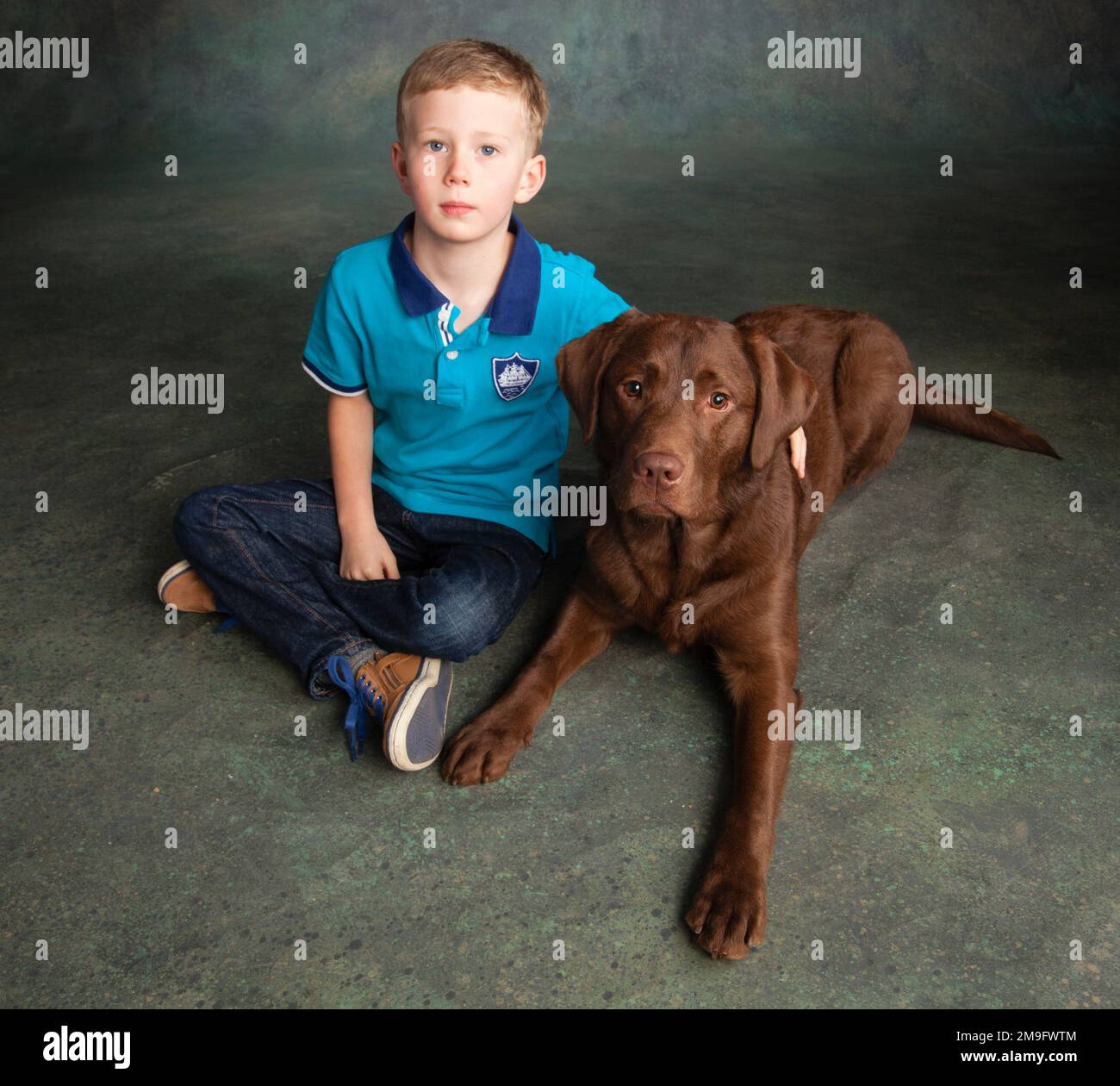 Boy sitting with dog hi-res stock photography and images - Alamy