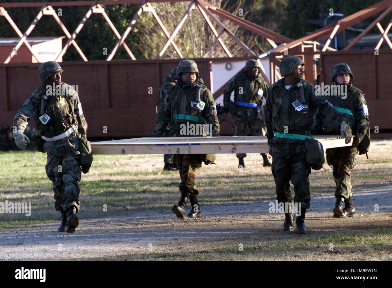Four US Air Force Civil Engineers from Langley AFB, Virginia carry ...